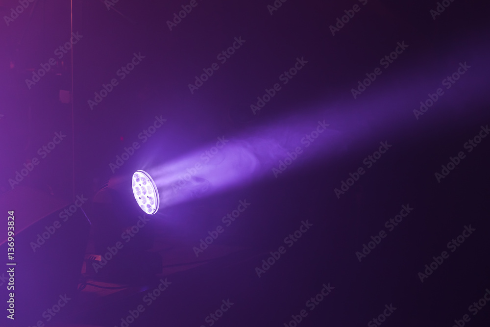 Stage LED spot light with purple beam Stock Photo | Adobe Stock