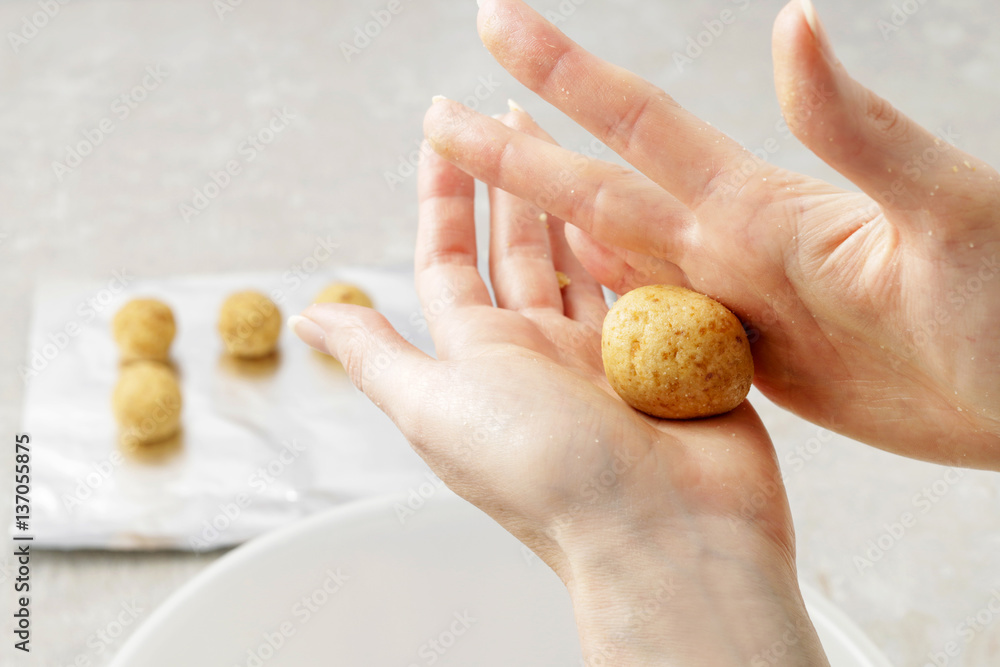 How to make cake pops - round out the cake balls with your hands Stock ...