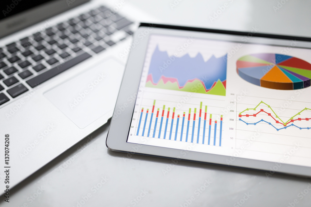 Tablet computer with business chart Stock Photo | Adobe Stock