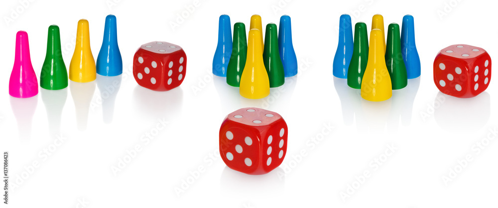 Colored pawns and red dice. Set pieces in the colors yellow, green ...