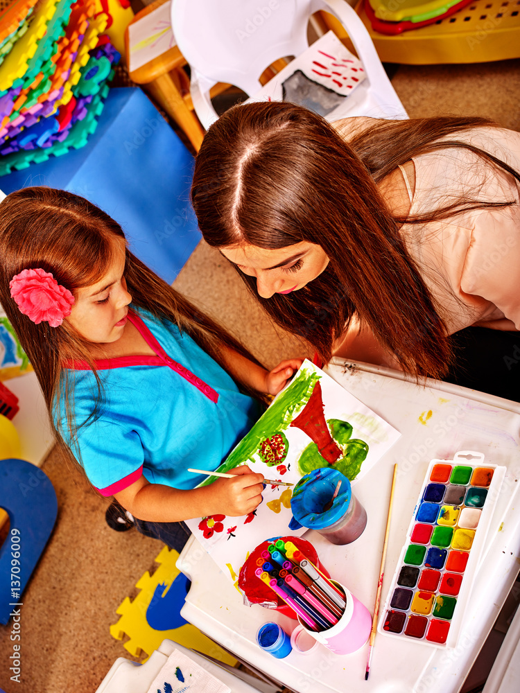 Child painting and drawing in kids club. Craft lesson in primary school ...