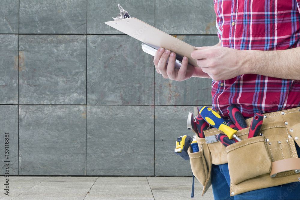 worker of the construction with the tools and the folder Stock Photo ...