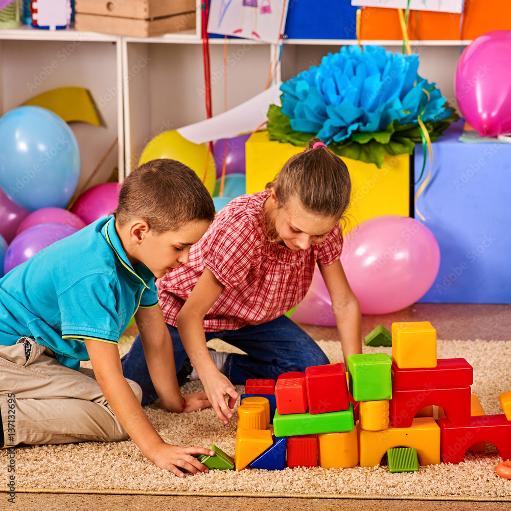 Children playing in kids club indoor. Lesson in primary school. Boy and ...