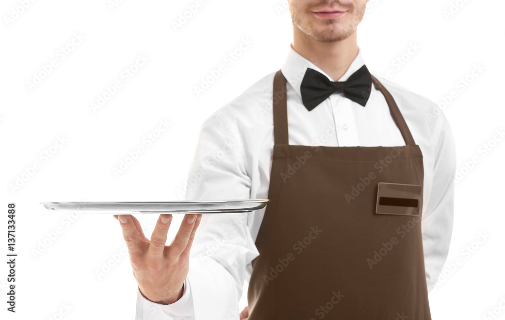 Waiter holding empty silver tray over white background.Focus on the ...