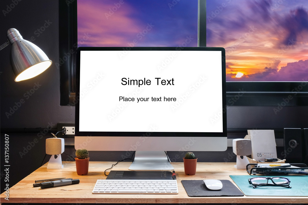 Graphic designer's workspace equipped with a pen tablet, a computer and ...