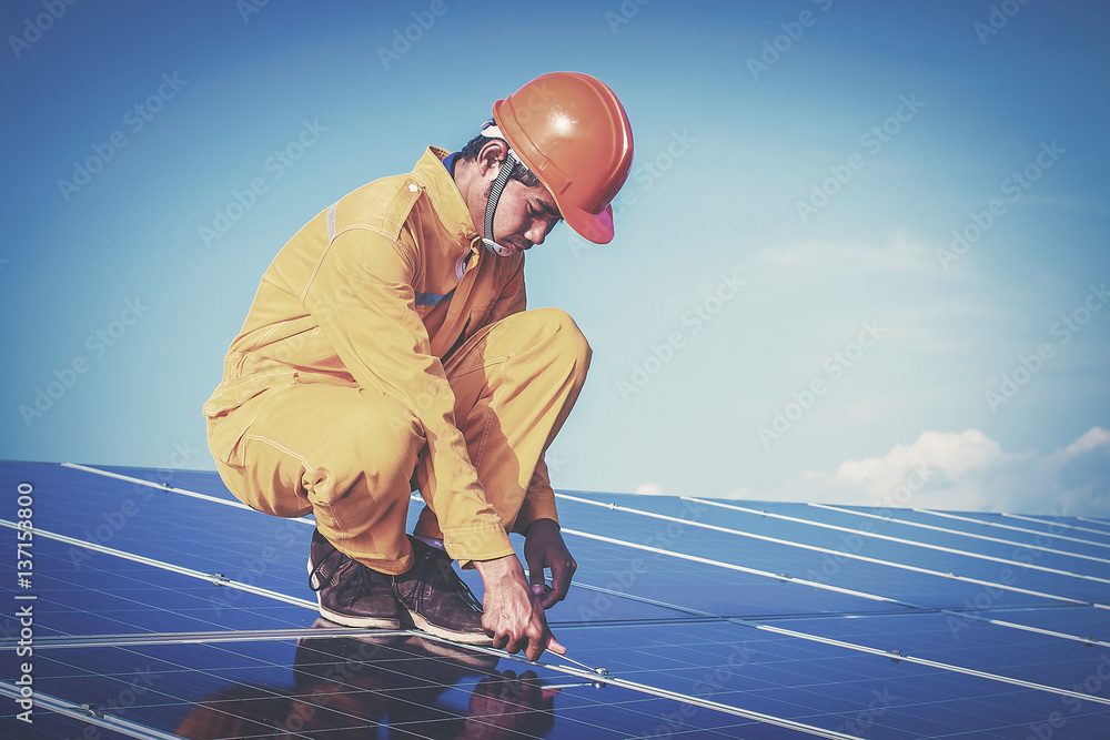 engineer working on checking and maintenance equipment at green energy ...