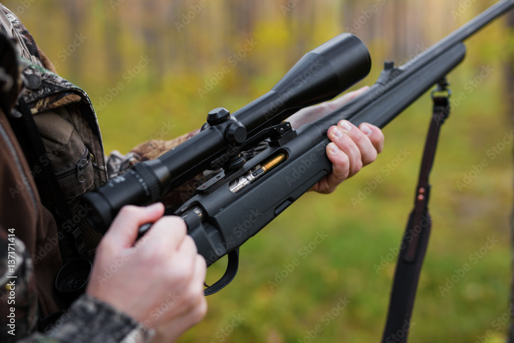 Hunter loading his gun Stock Photo | Adobe Stock
