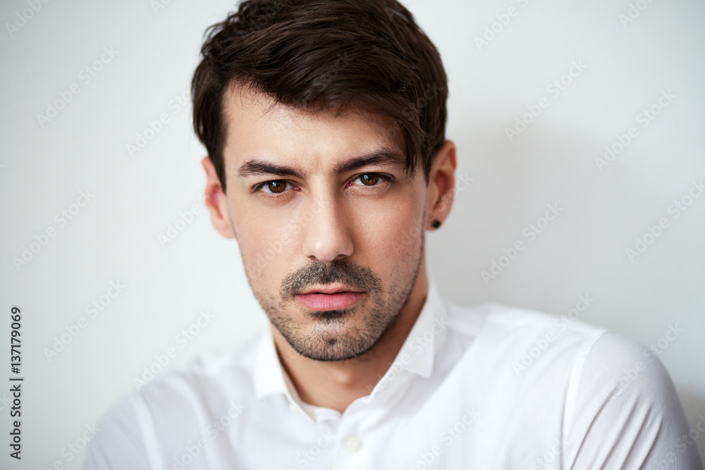 serious young man Stock Photo | Adobe Stock