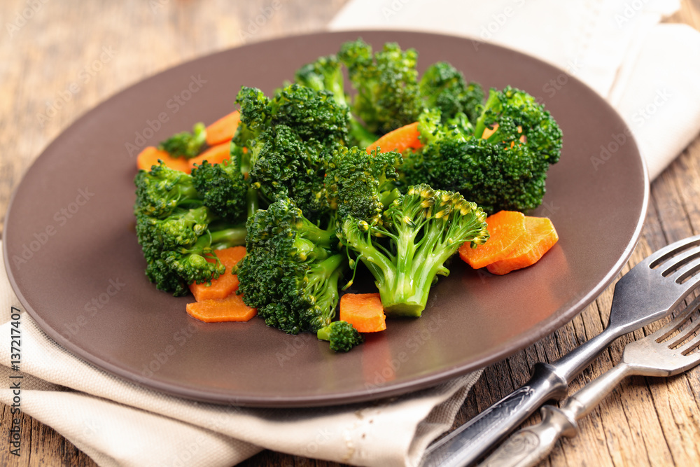 Steamed broccoli on plate. Stock Photo | Adobe Stock