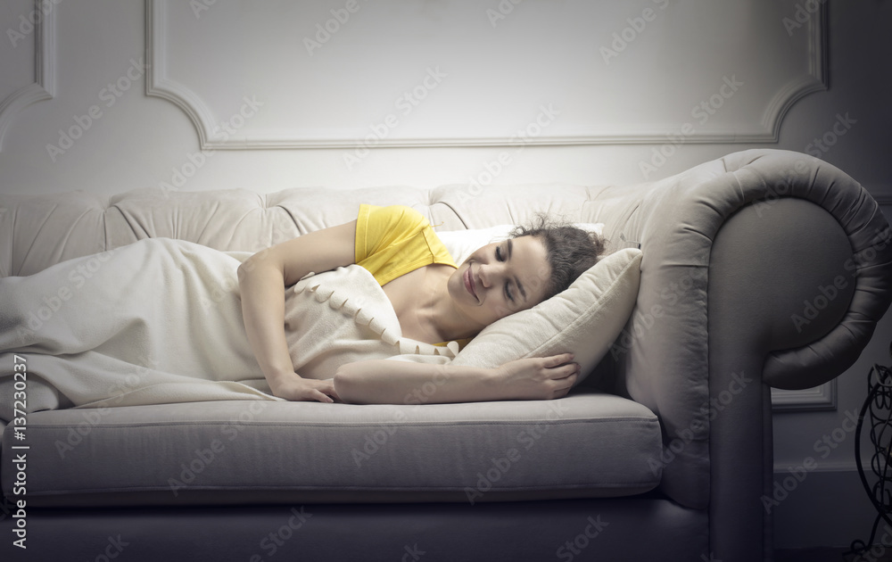 Pretty girl sleeping on the sofa Stock Photo | Adobe Stock