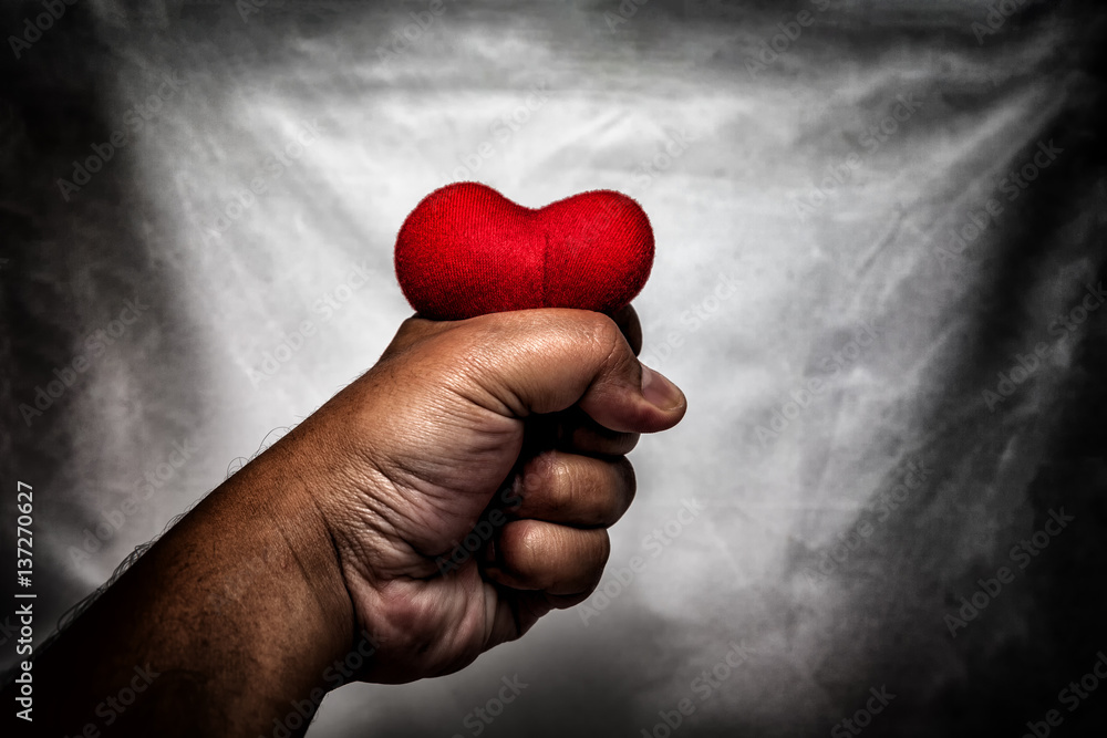 angry man crushing red heart in hand., unrequited love., love concept ...