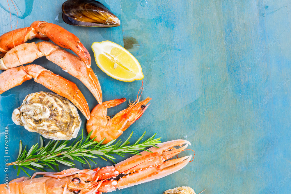 Fresh seafood set border with copy space on blue background Stock Photo ...