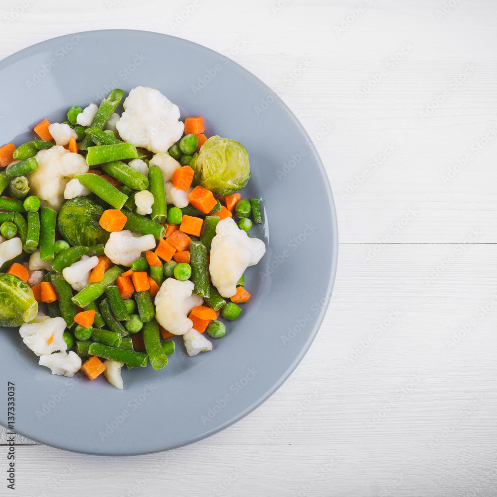 Delicious mix of vegetables on the plate. View from above. Close-up ...