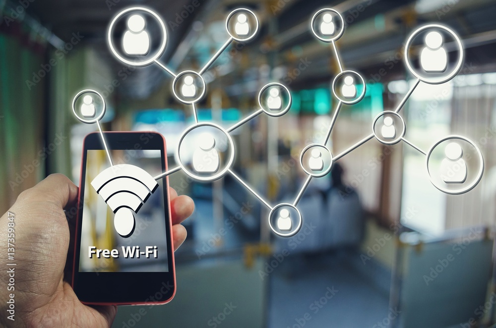 Hand using Smartphone and is using free wifi with icon social media ...