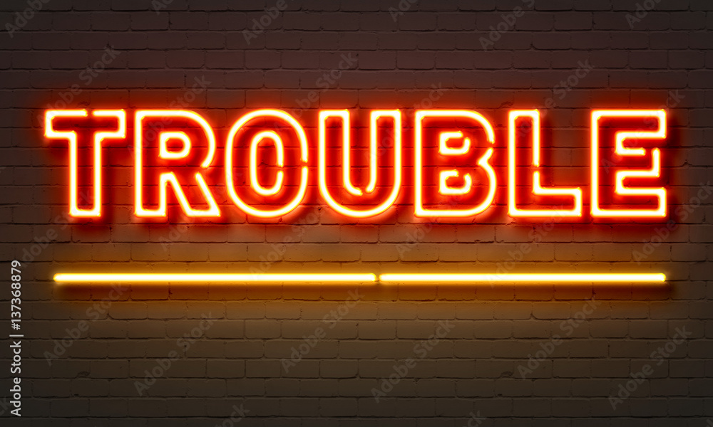 Trouble neon sign on brick wall background. Stock Illustration | Adobe ...