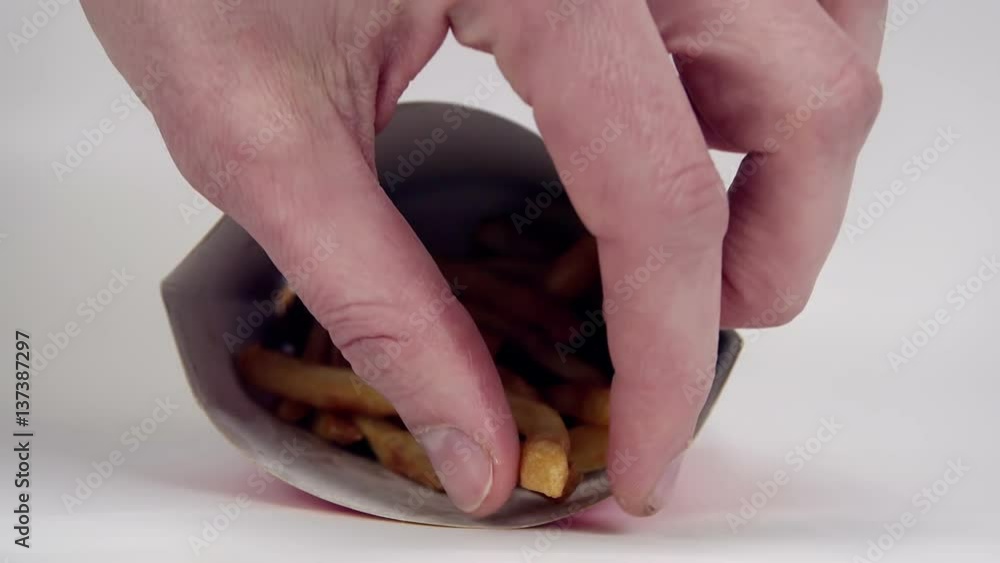 Adult male hand picking out fries to eat from fast food box Stock Video ...