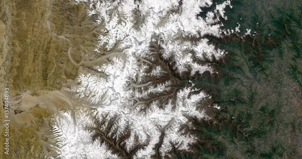 High-altitude overflight aerial of Mount Everest and adjacent land ...