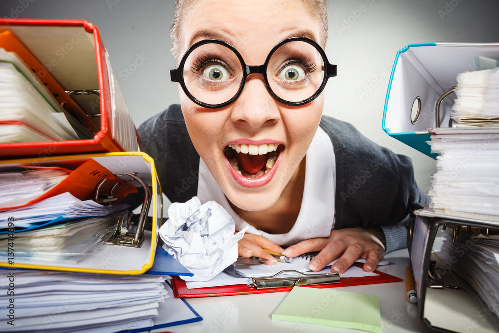 Insane office woman at work. foto de Stock | Adobe Stock