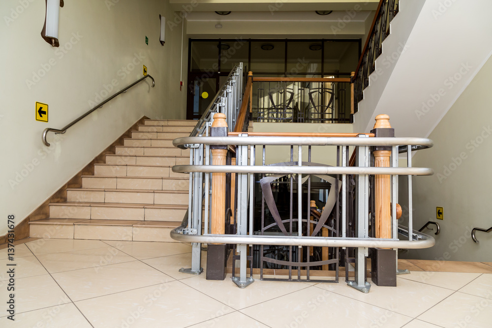 Stair lift for the disabled. Stairs of public building. Stock Photo ...