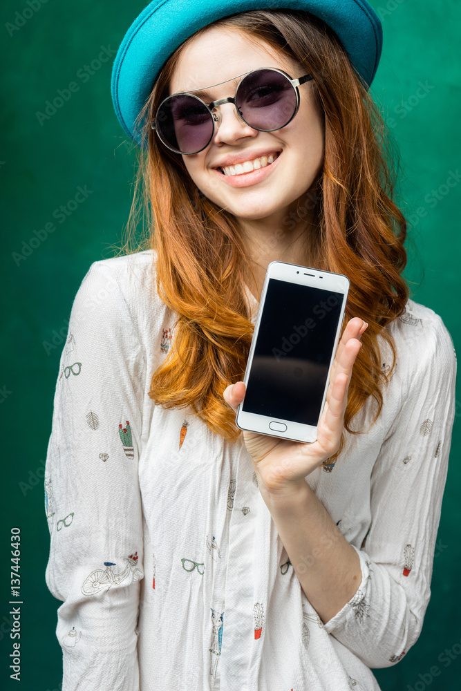 Joyful face girl shows black blank screen of smartphone. Woman ...