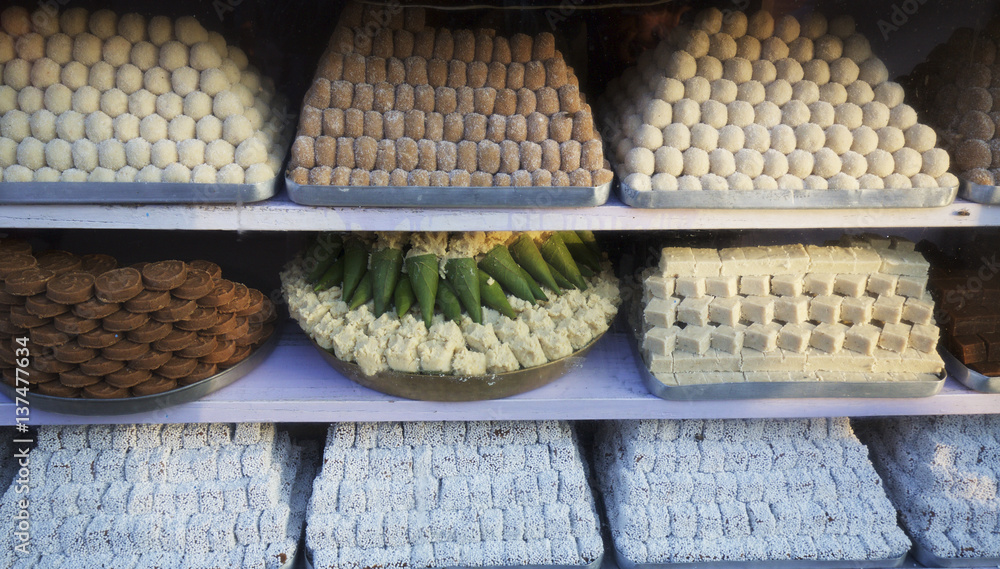 Display of Indian sweets in a sweetshop in the bazaar Stock Photo ...
