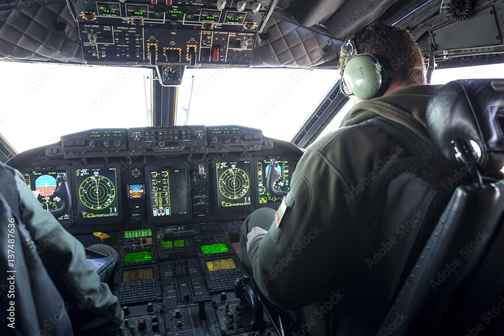 Military carrier airplane cockpit and pilots Stock Photo | Adobe Stock