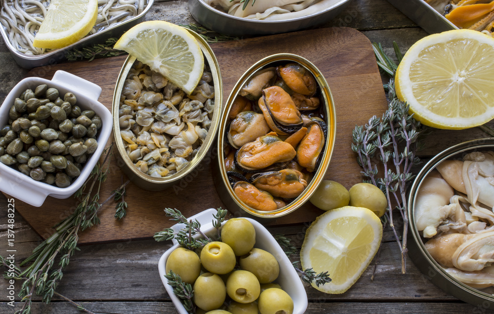 Assortment of cans of canned with different types of fish and seafood ...