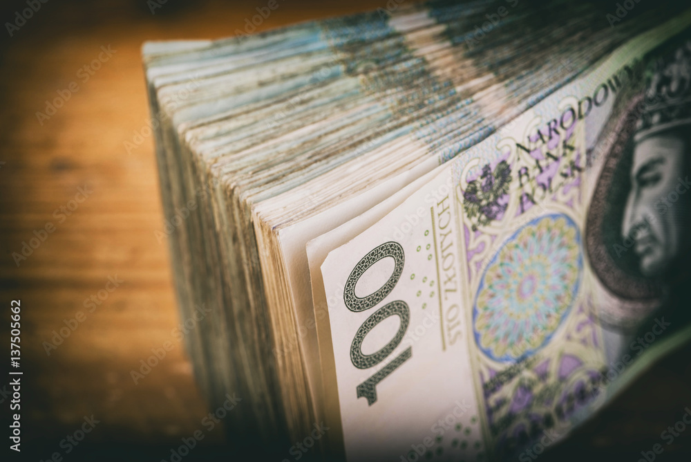 Polish currency PLN, money. File roll of banknotes of 100 PLN (P Stock ...