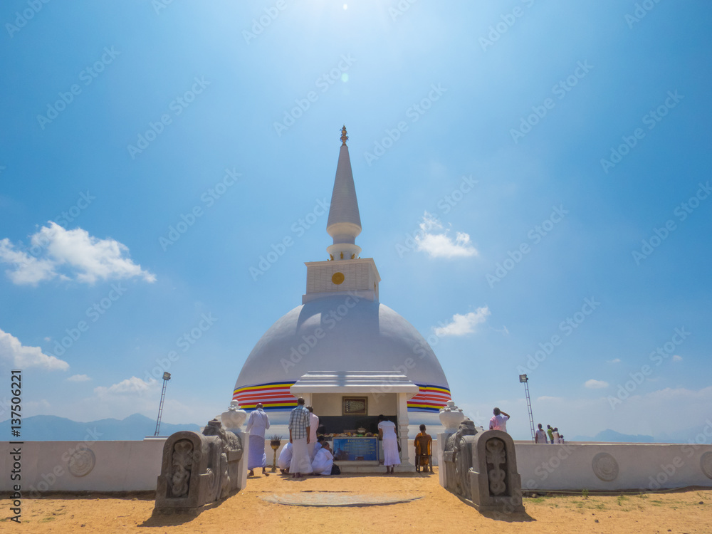 Pilgrims in white dress worshiping White Stupa Dagoba Dagabo at ...
