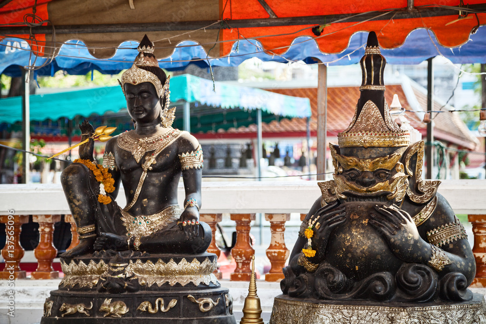 Buddha and Rahu sculptures at Buddhist shrine in Thailand. Hindu ...