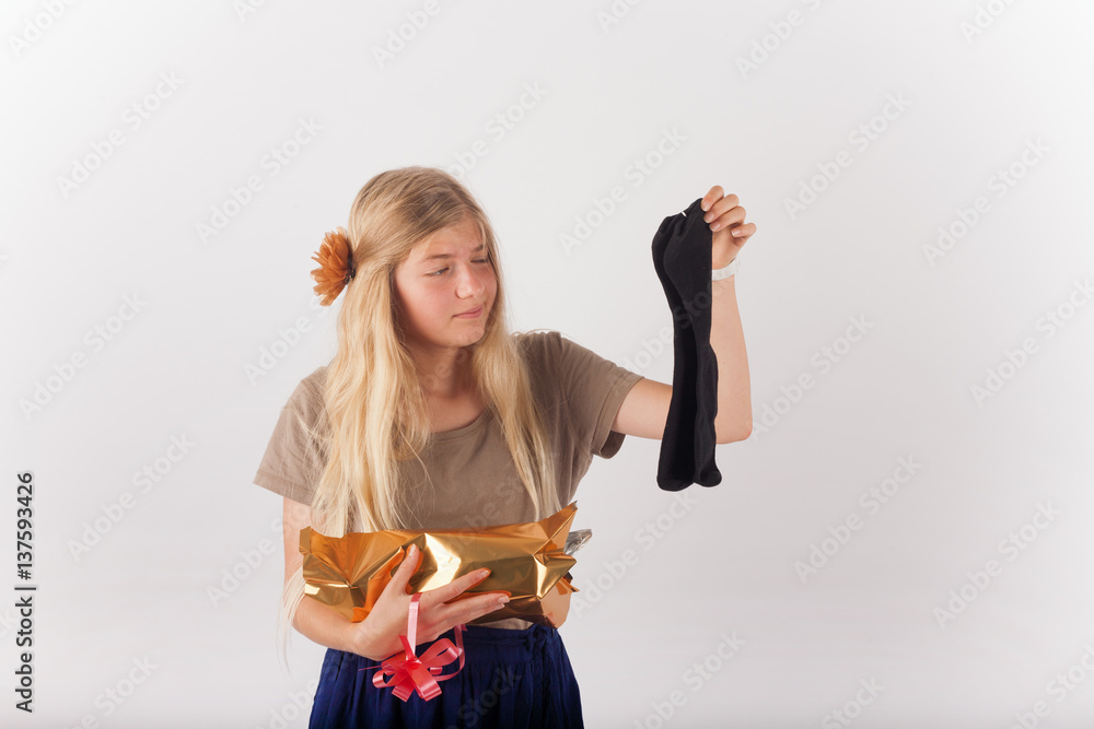 Beautiful young woman very disappointed with her present Stock Photo ...