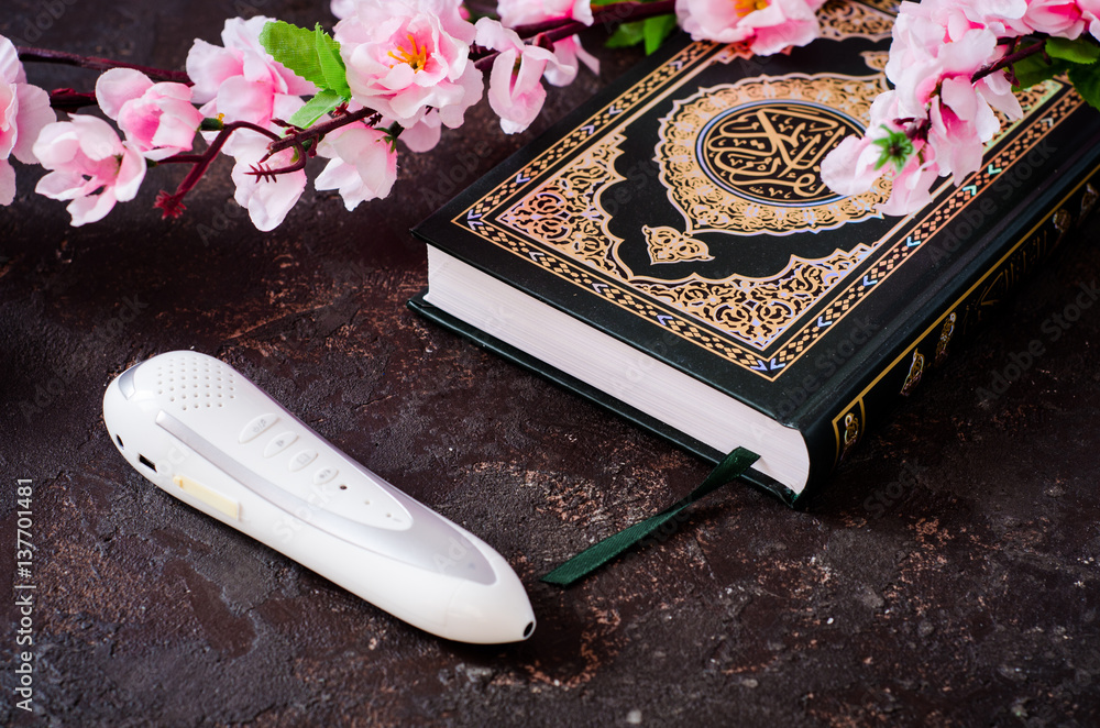 Islamic Book Koran and readpen on dark vintage background with arabic ...