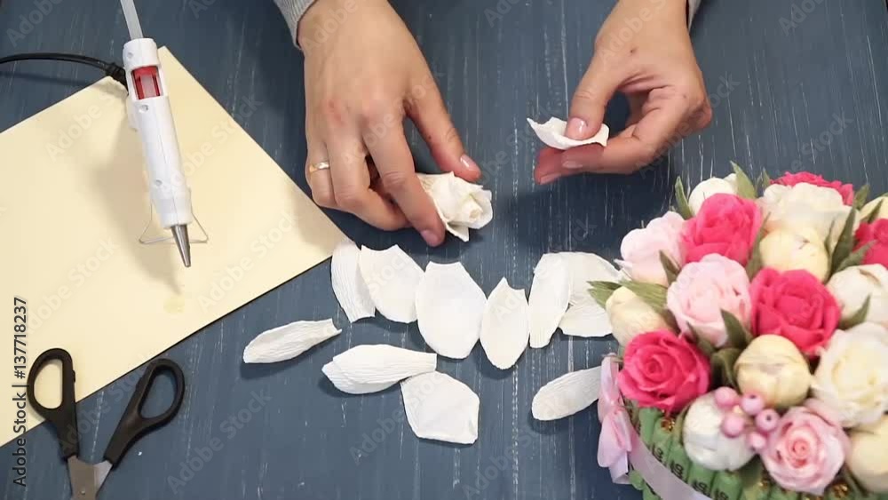Close-up of corrugated paper hack bright pink in female hands. Female ...