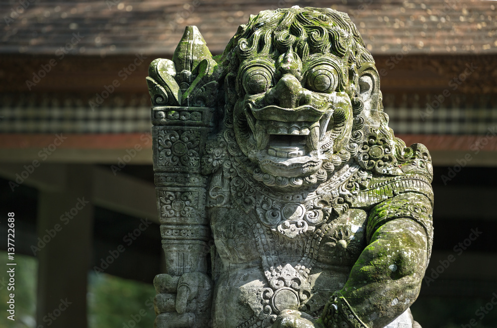 Statues and carvings depicting demons, gods and Balinese mythological ...