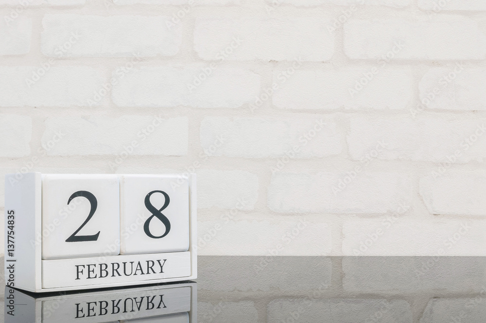 Closeup white wooden calendar with black 28 february word on black ...