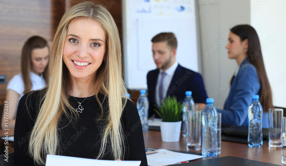 business woman with her staff, people group in background at modern ...