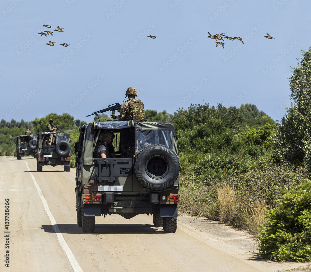Military motorcade vehicles with weapons and soldiers Stock Photo ...