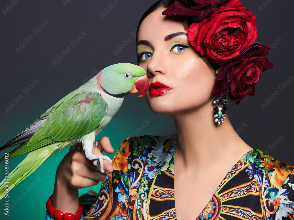 beautiful girl with a parrot and a flower in her hair Stock Photo ...
