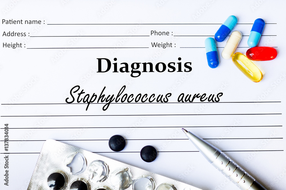 Staphylococcus aureus - Diagnosis written on a piece of white paper ...