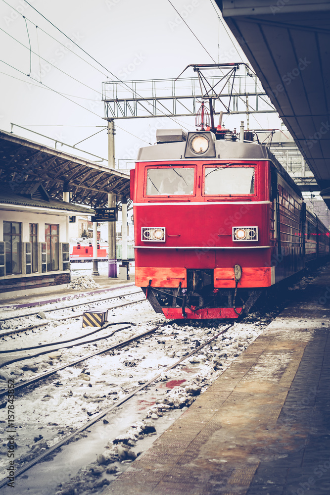 red train arriving at main station in Krasnoyarsk, Russia, trans ...