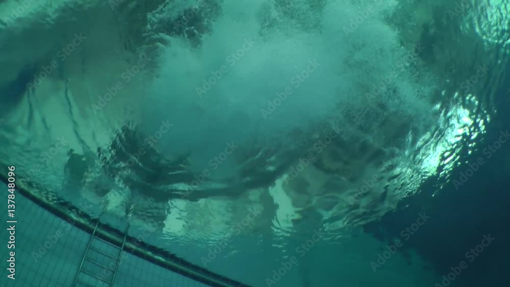 Diving (Jumping into the water), jump from a tower two athletes through ...