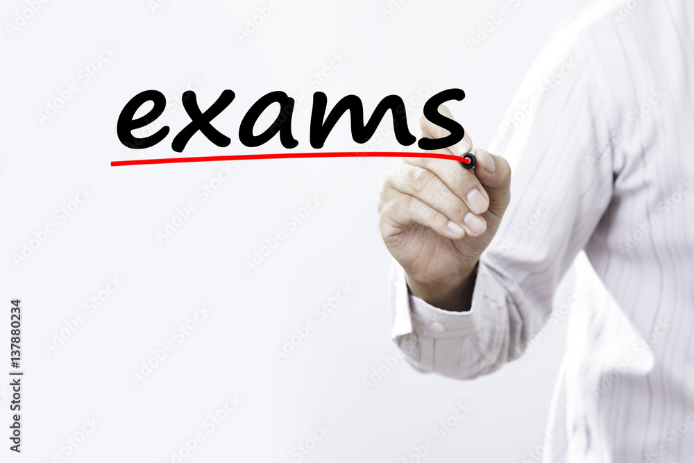 Businessman hand writing exams with red marker on transparent wipe ...
