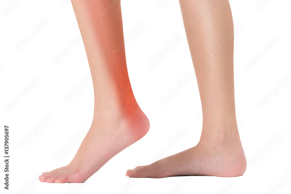Side view of woman's feet in walking pose with red highlighted on ankle ...