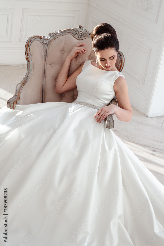 portrait of beautiful brunette bride with elegant hairstyle and makeup ...