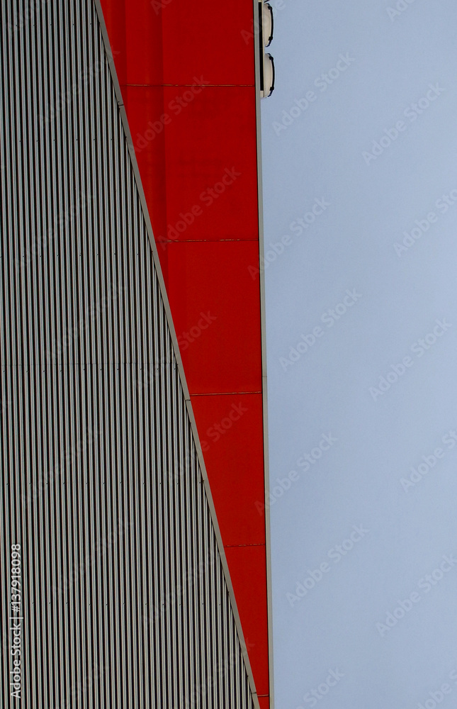 Abstract architecture. Aluminum cladding panels cross each other. Half ...