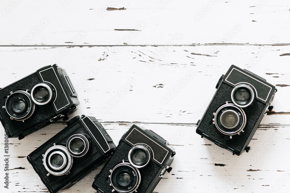 collection old vintage retro photo cameras on white wooden background ...