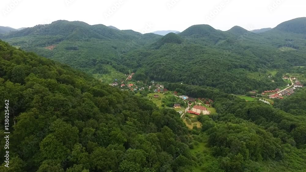 View from a very great height in a small cozy resort town in a wooded ...