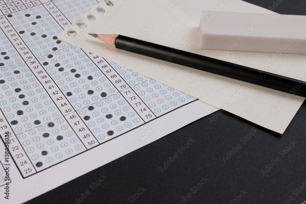 School exam answer sheet and pen. Standard test form or answer sheet ...
