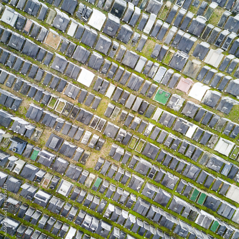 Cemetery. Top-down full-frame aerial view of rows of graves in a ...