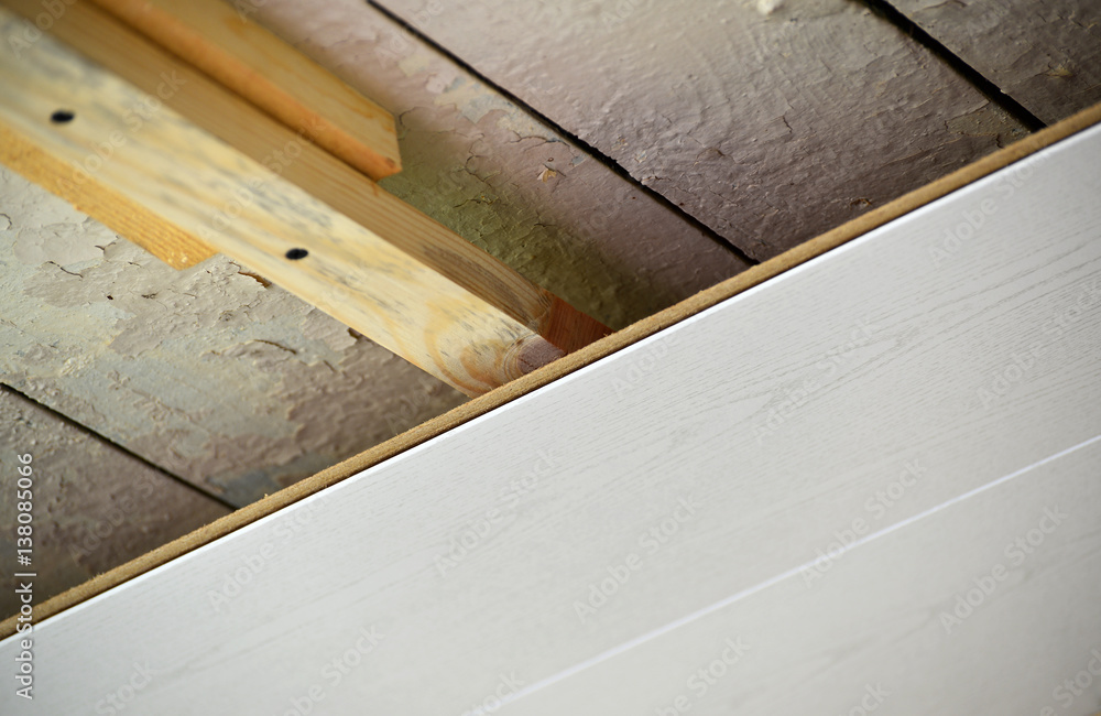 Installation of ceiling of MDF panels Stock Photo | Adobe Stock